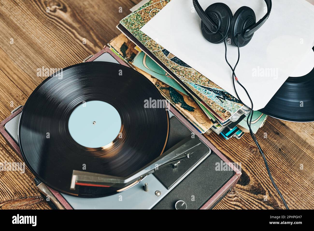 Listening to music from vinyl record. Playing music from analog disk on ...