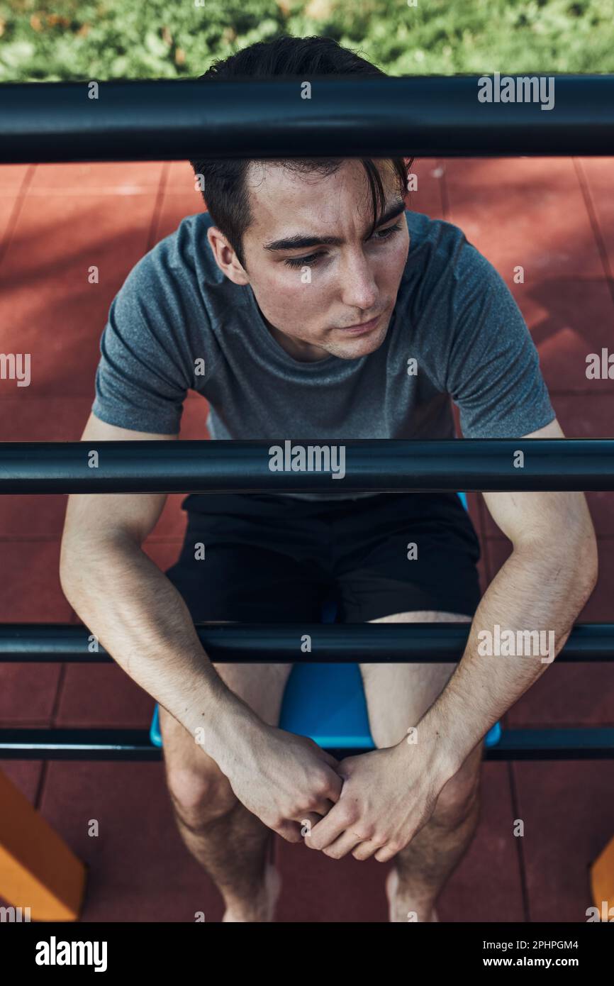Portrait of young man having break during his workout in a modern ...