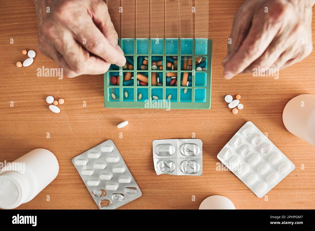 Senior man taking medicines hi-res stock photography and images - Alamy