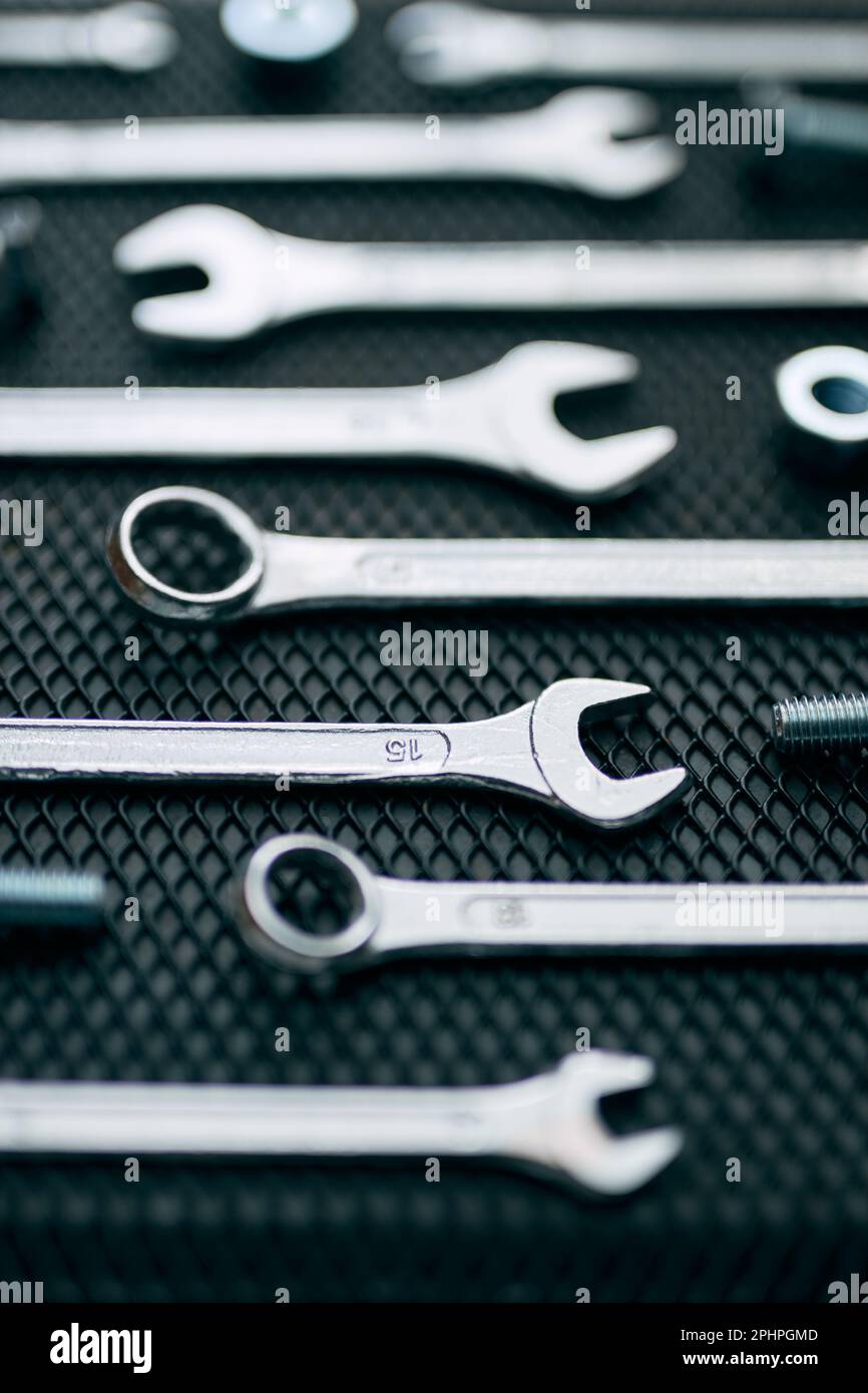 Set of chrome wrenches on steel surface. Mechanic tools for maintenance ...