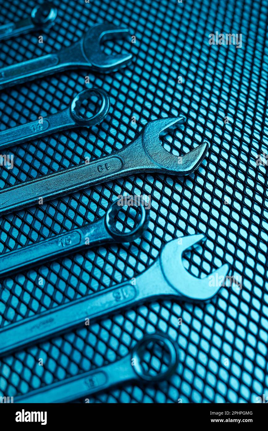 Set of chrome wrenches on steel surface. Mechanic tools for maintenance ...