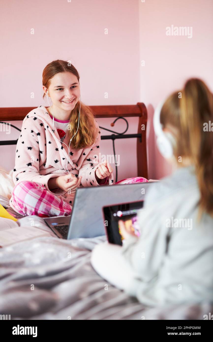 Student learning online, watching lesson remotely, listening to ...