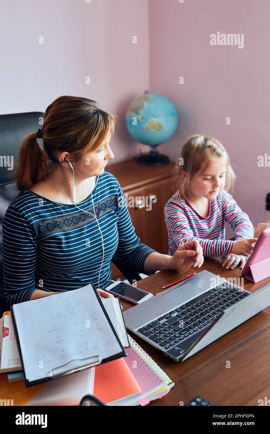 Parent watching child learn on computer hi-res stock photography and ...