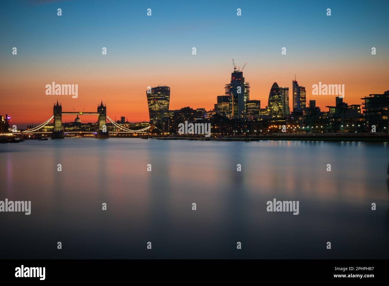 Long exposure, London skyline and tower bridge with the River Thames ...
