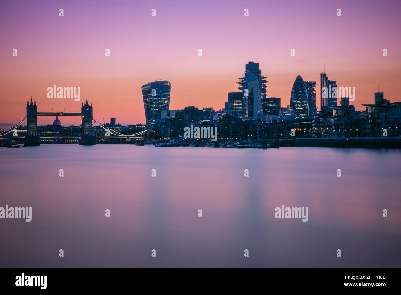 Long exposure, London skyline and tower bridge with the River Thames ...