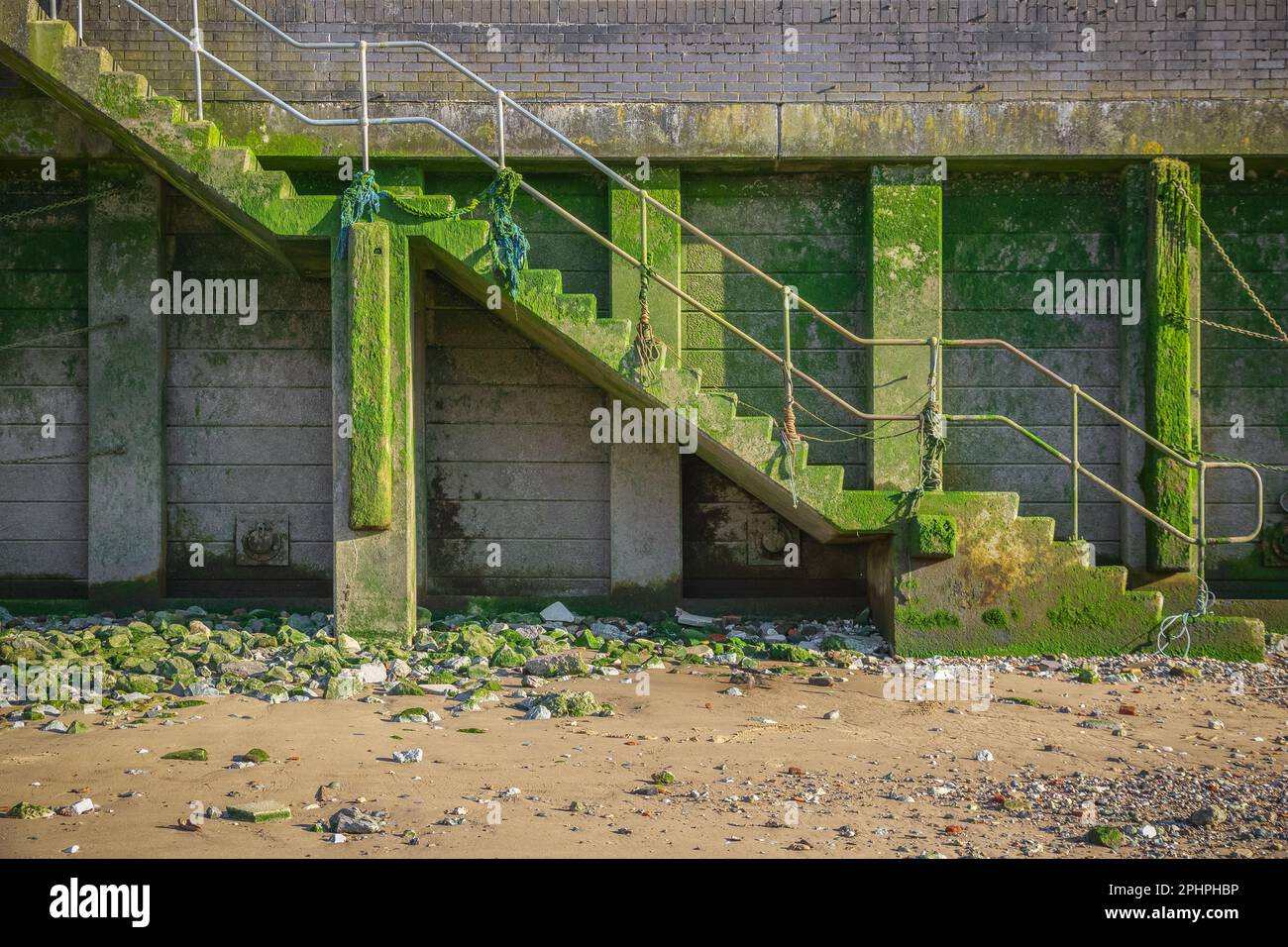 Mossed concrete steps to the foreshore of river Thames at low tide in ...
