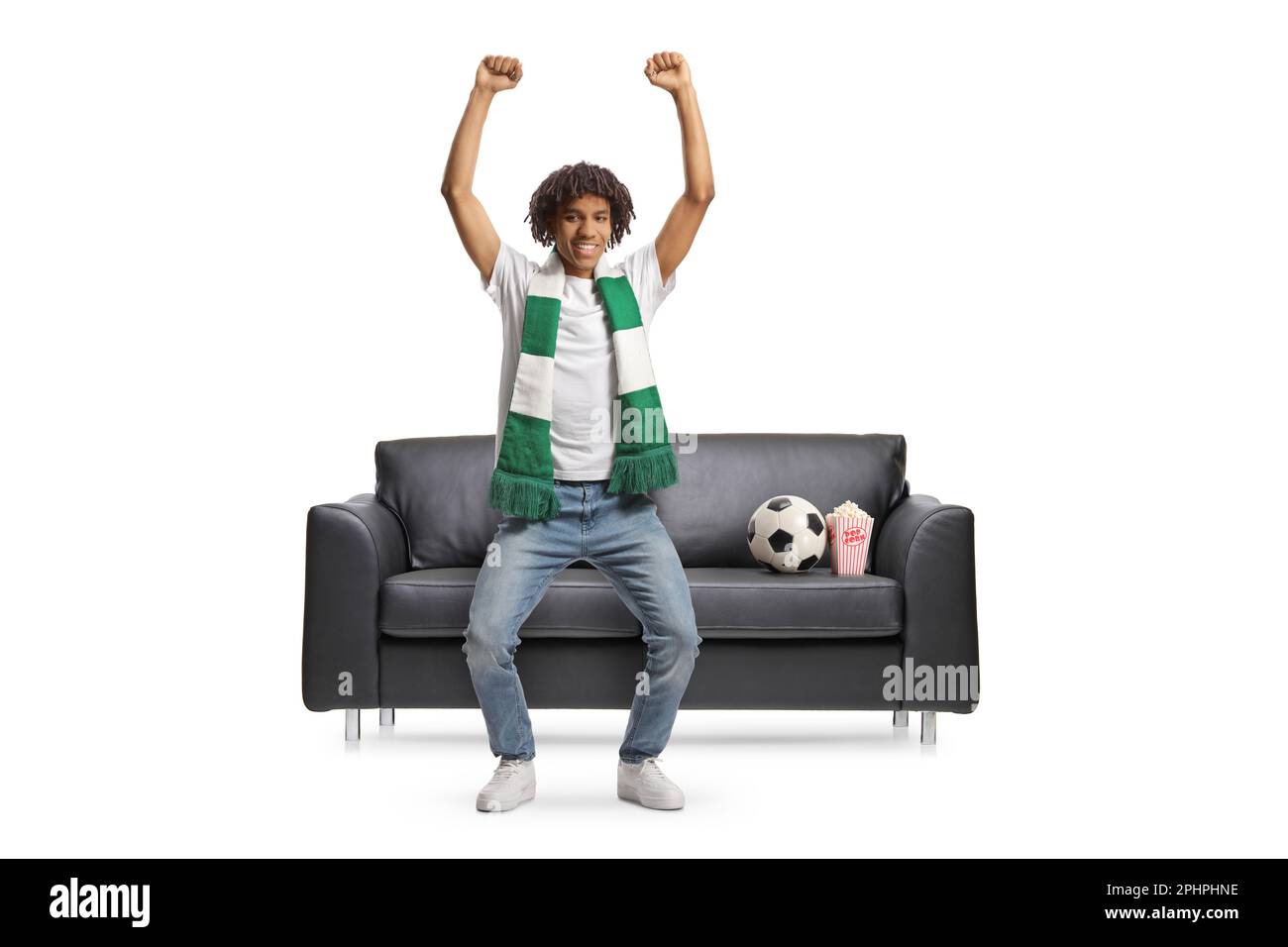Happy african american guy cheering for a football team with a green ...