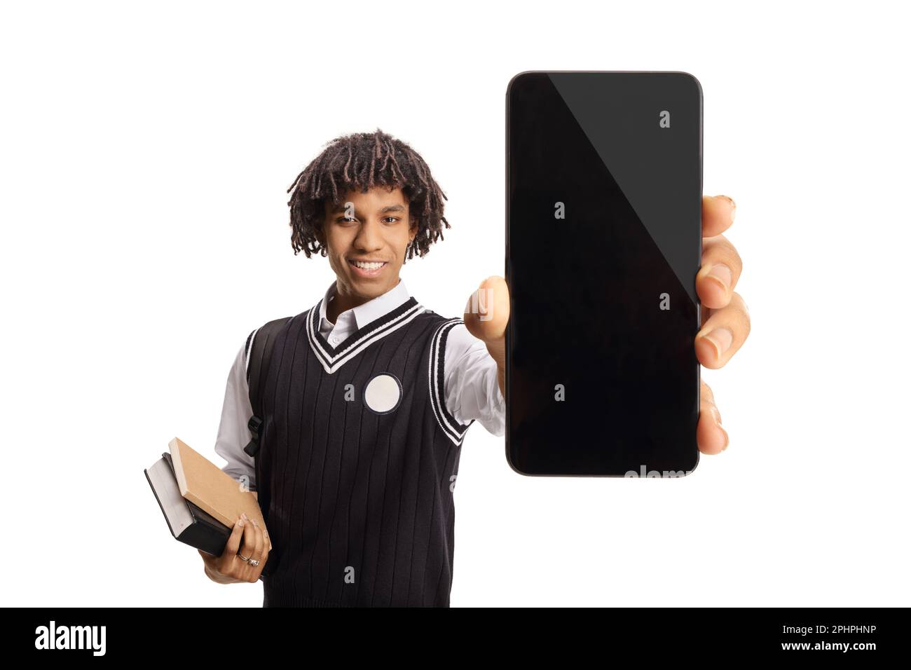 African american male student in a uniform holding books and showing a ...