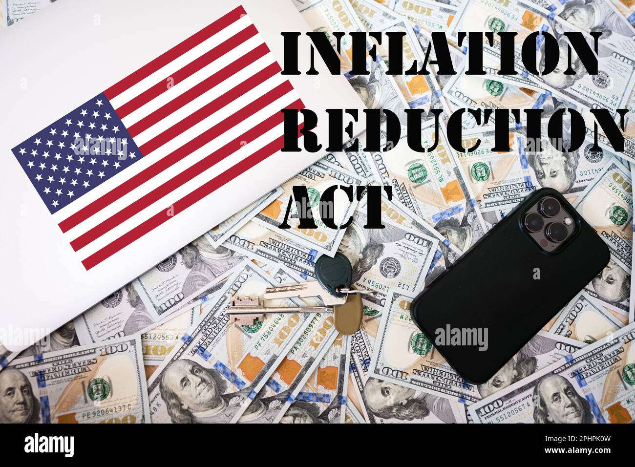 Inflation reduction act concept. USA flag, dollar money with keys ...