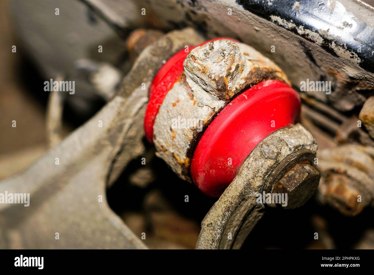 A red polyurethane bushing is installed in the suspension of the ...