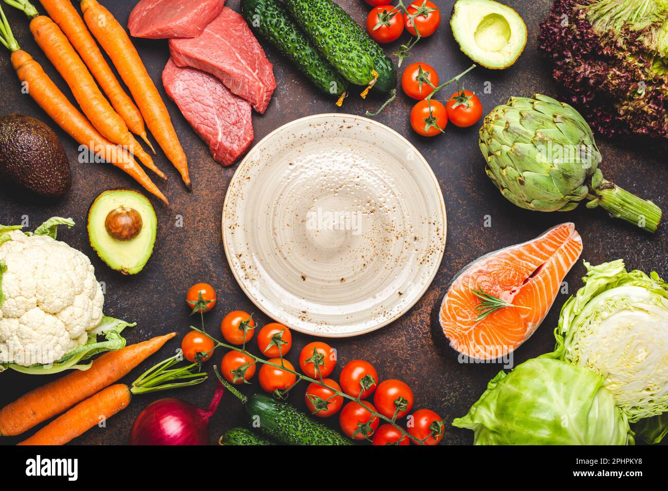 Assorted food raw products: vegetables, beef meat, fish salmon and ...