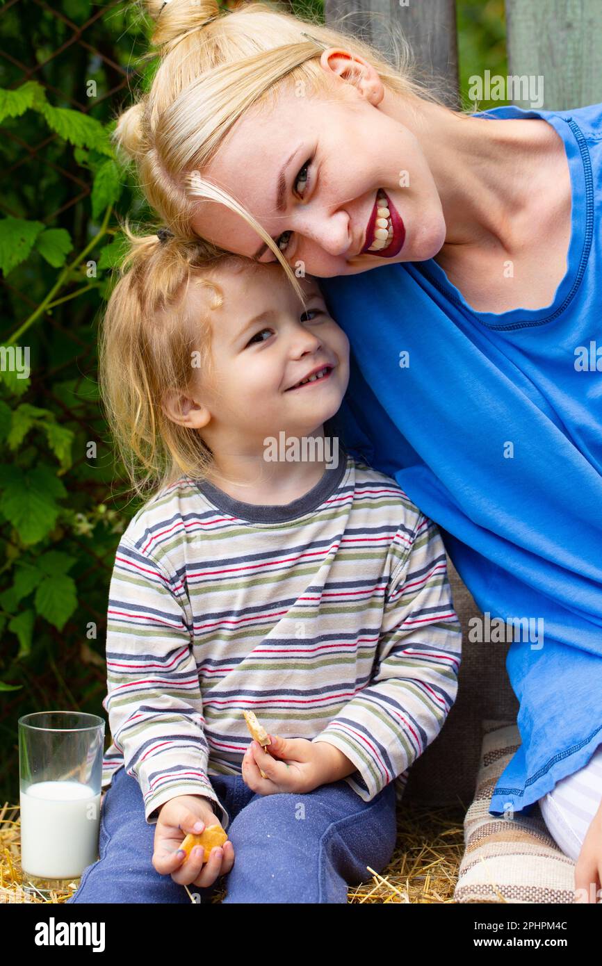 Mother hug. Portrait of young mother and child hugging. Mother hugging ...