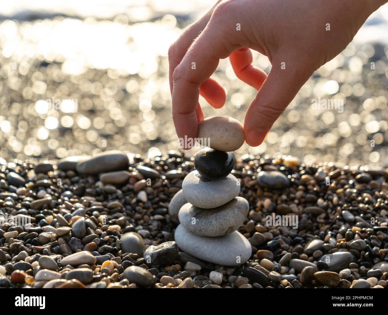 Stone pyramid. Pebbles balance pile, harmony zen stones, balance stack ...