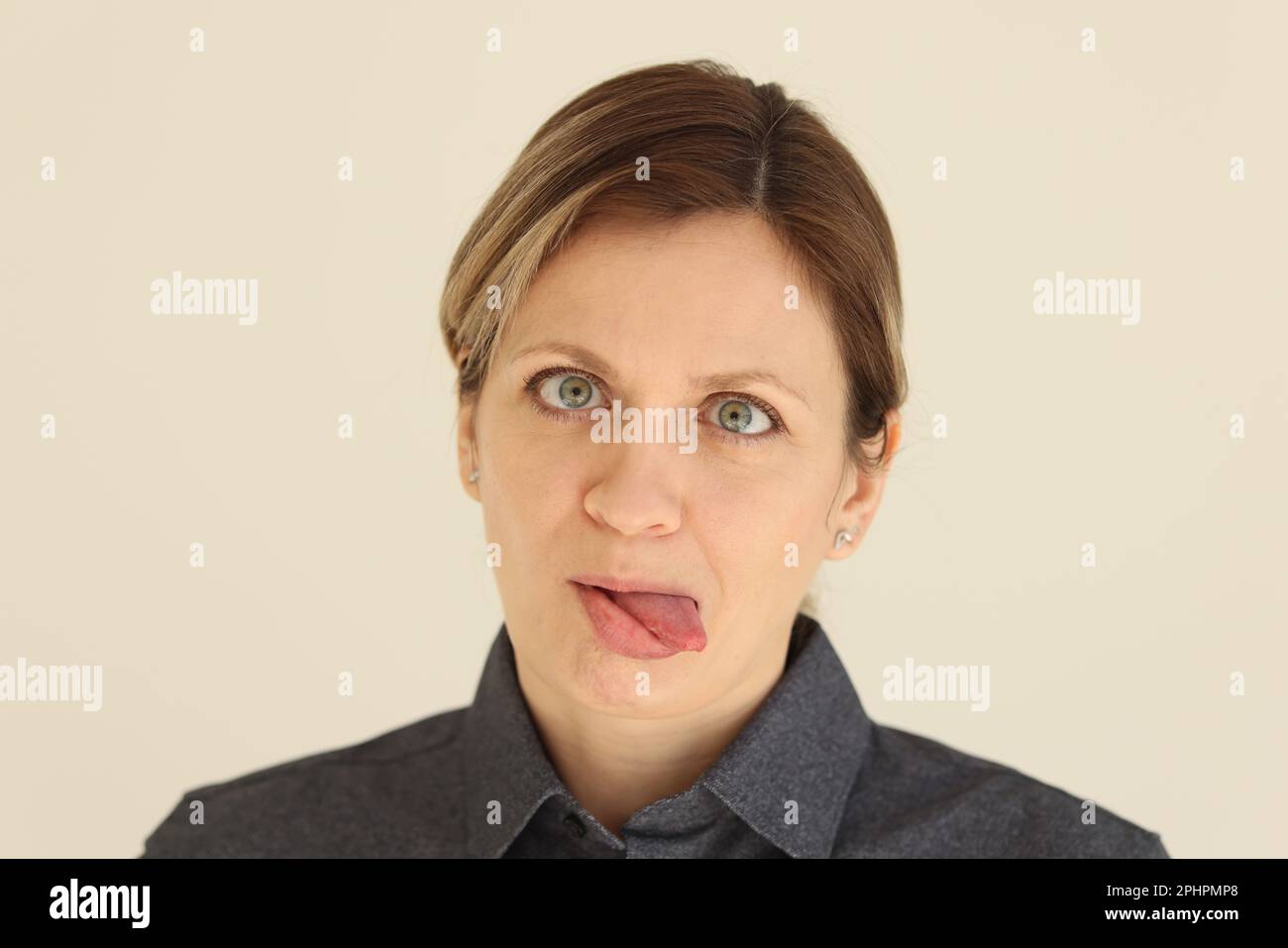 Grimacing grimace face tongue woman hi-res stock photography and images ...