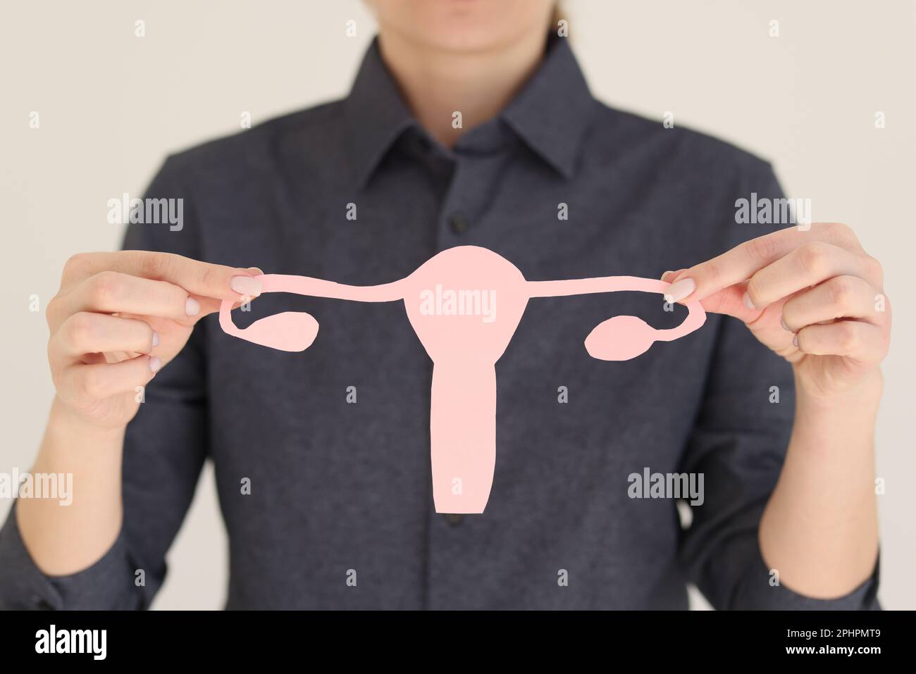Woman holding symbol of fight against female infertility Stock Photo ...