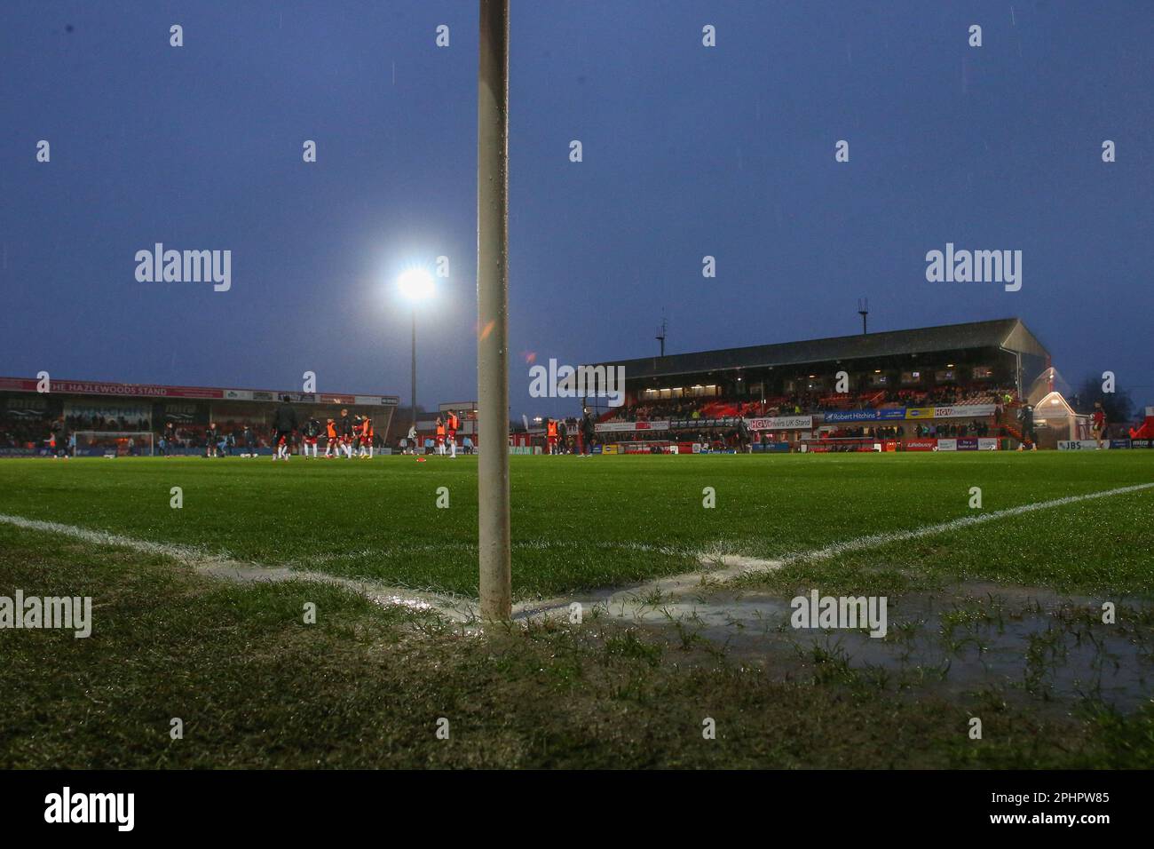 Heavy rain fall causes puddles on the pitch ahead of the Sky Bet League ...