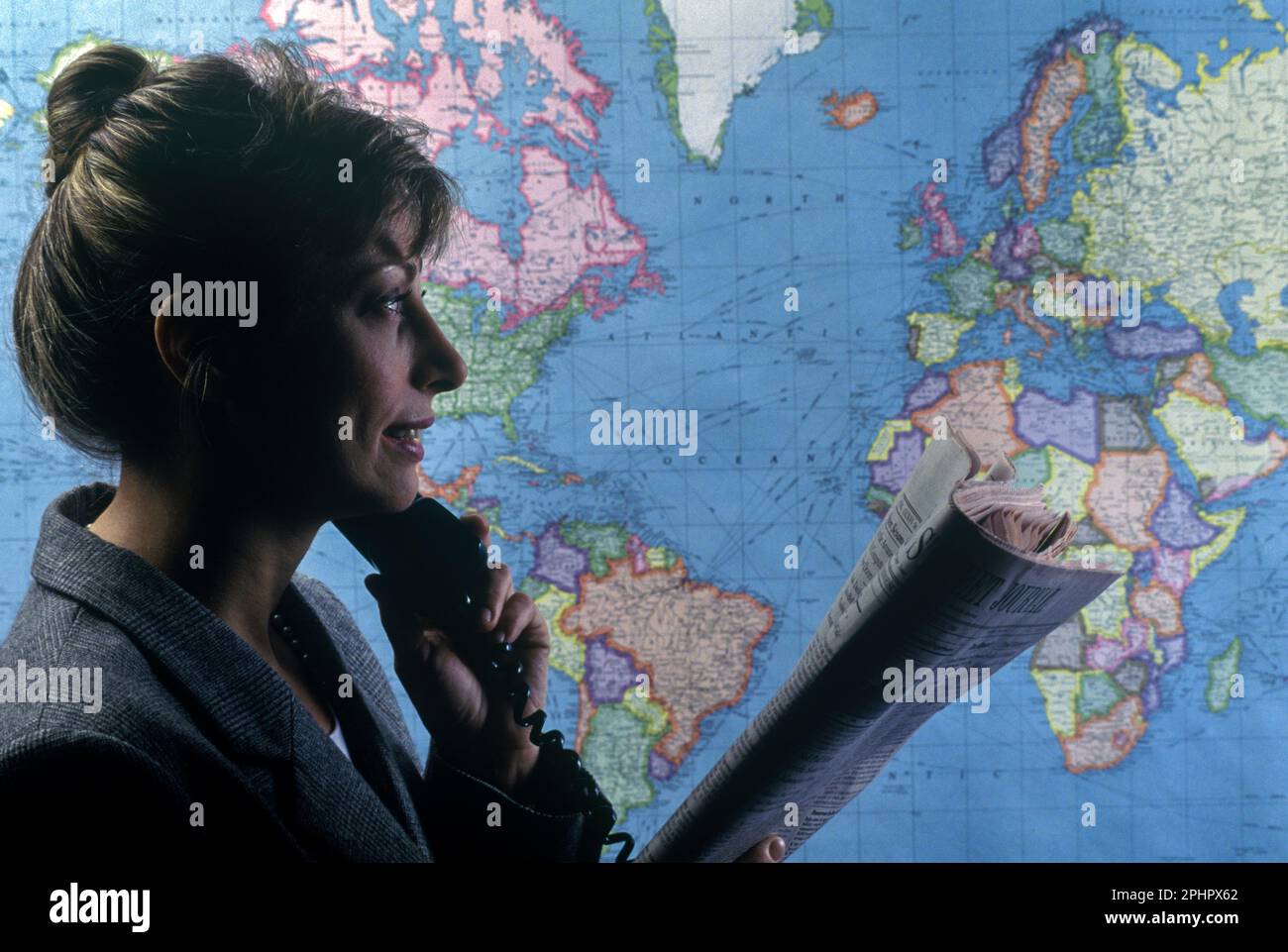 1990 HISTORICAL FEMALE OFFICE WORKER READING FINANCIAL NEWSPAPER (©DOW ...