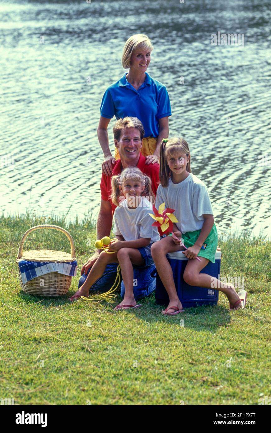 1990 HISTORICAL FAMILY TOGETHER OUTSIDE ON PICNIC BY LAKE Stock Photo ...