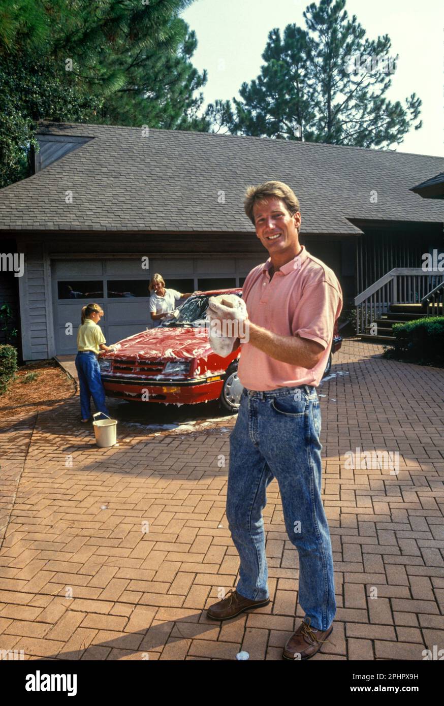 1990 HISTORICAL FAMILY WASHING RED AUTOMOBILE (©CHRYSLER CORP 1990) IN ...