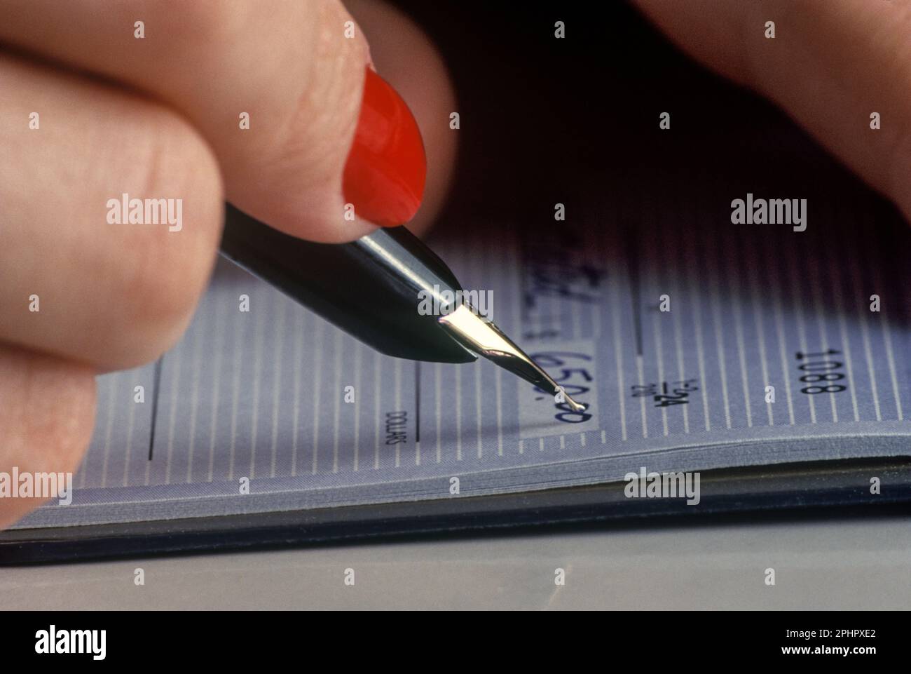 Hand writing cheque hi-res stock photography and images - Alamy