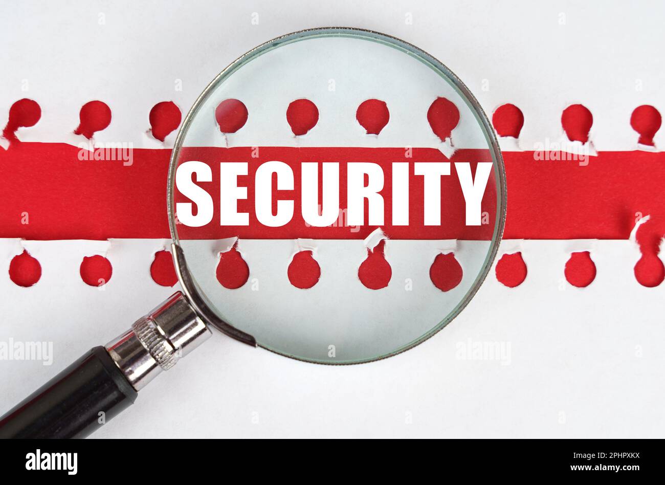 Between two sheets from a notebook on a red stripe with the inscription - security, there is a ...