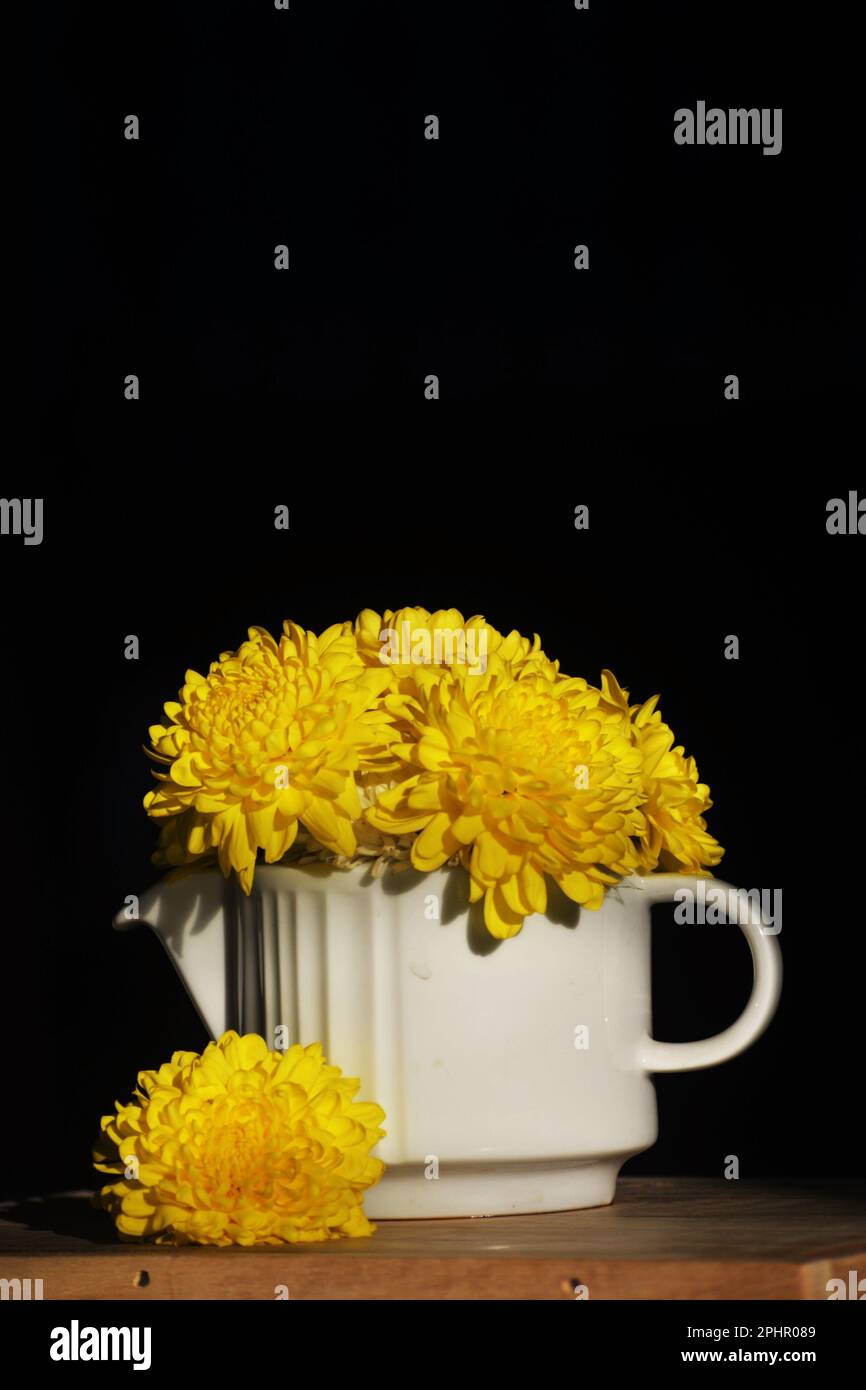 Still life with yellow flowers Stock Photo - Alamy