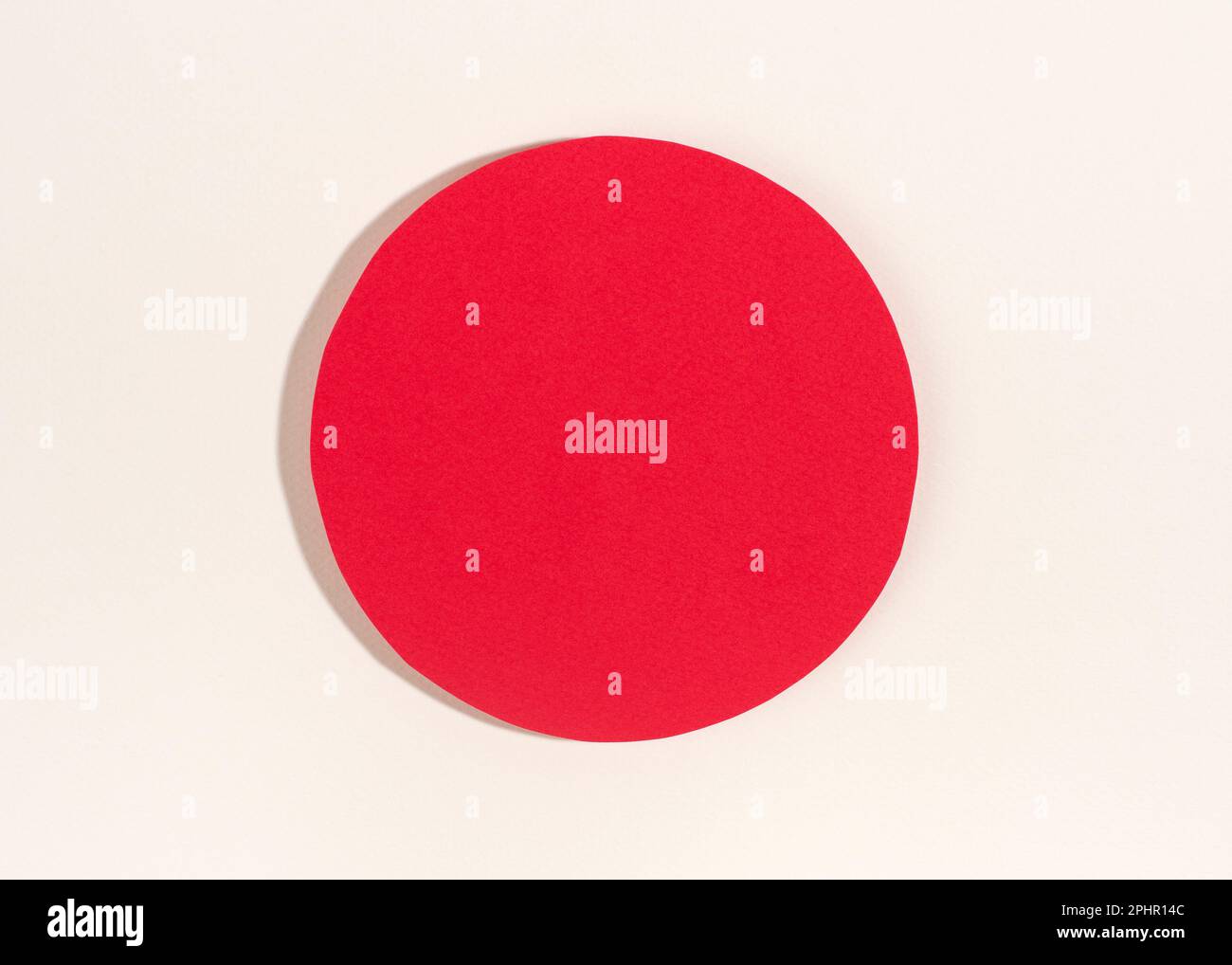 Red paper circle with shadow on white background Stock Photo - Alamy