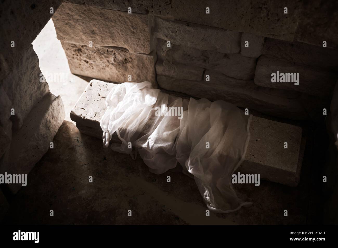 Empty tomb while light shines from the outside. Jesus Christ ...