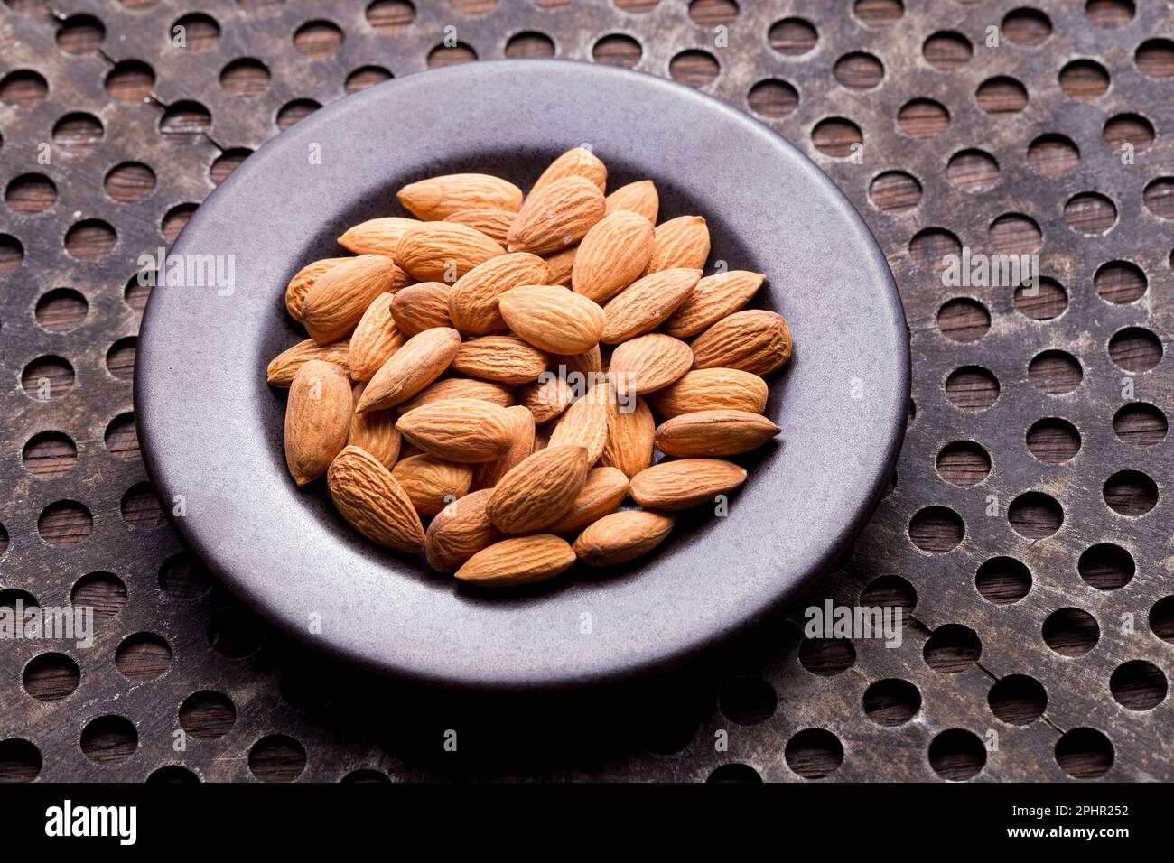 pile of natural almonds (Prunus dulcis) close-up image Stock Photo - Alamy