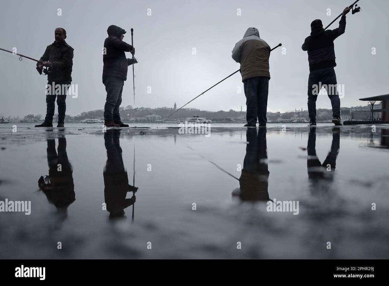 Istanbul, Istanbul, Turkey. 29th Mar, 2023. fishermen wearing their ...