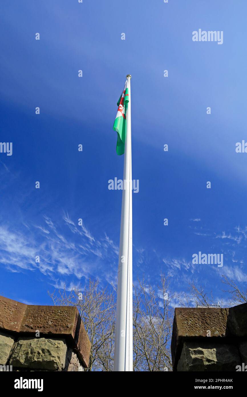 Welsh flag hanging limply on a flagpole against the sky, March 2023 ...