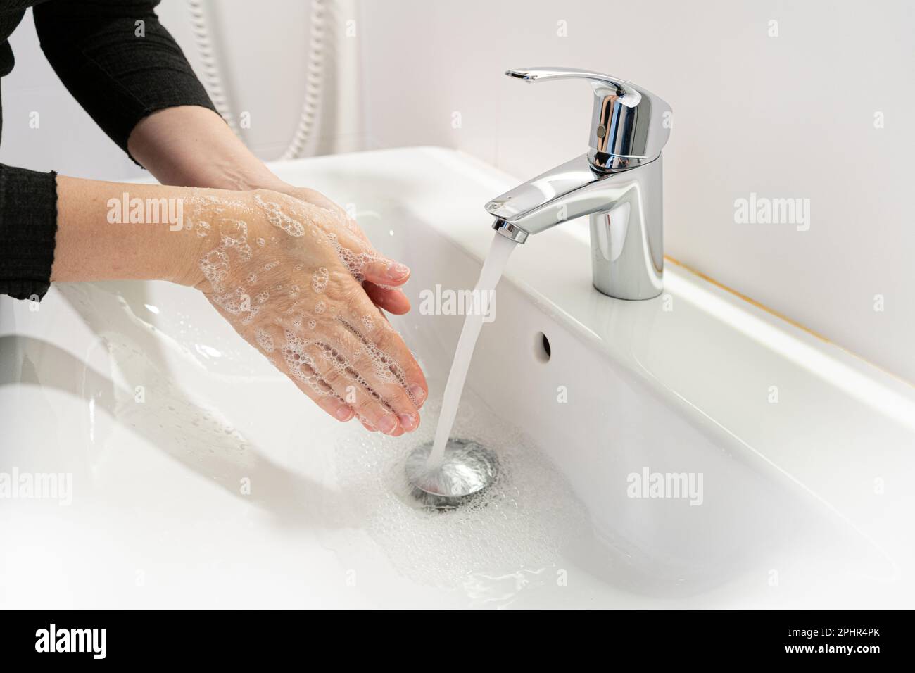 Washing hands with soap closeup. Woman wash her palms, soapy arms ...