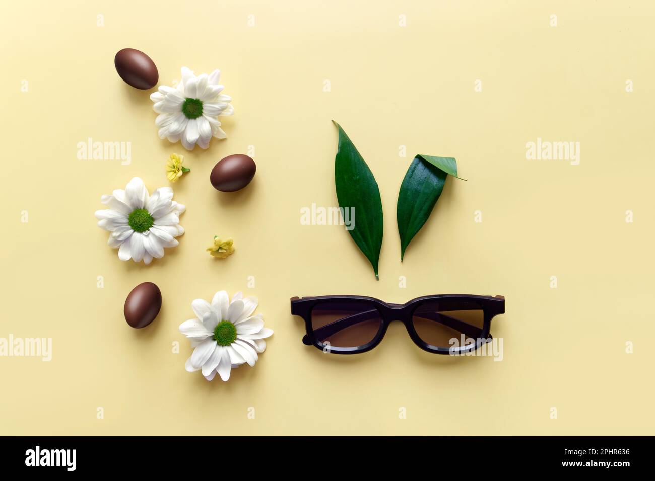 chocolate easter eggs with chamomile. Bunny Ears from leaves and ...