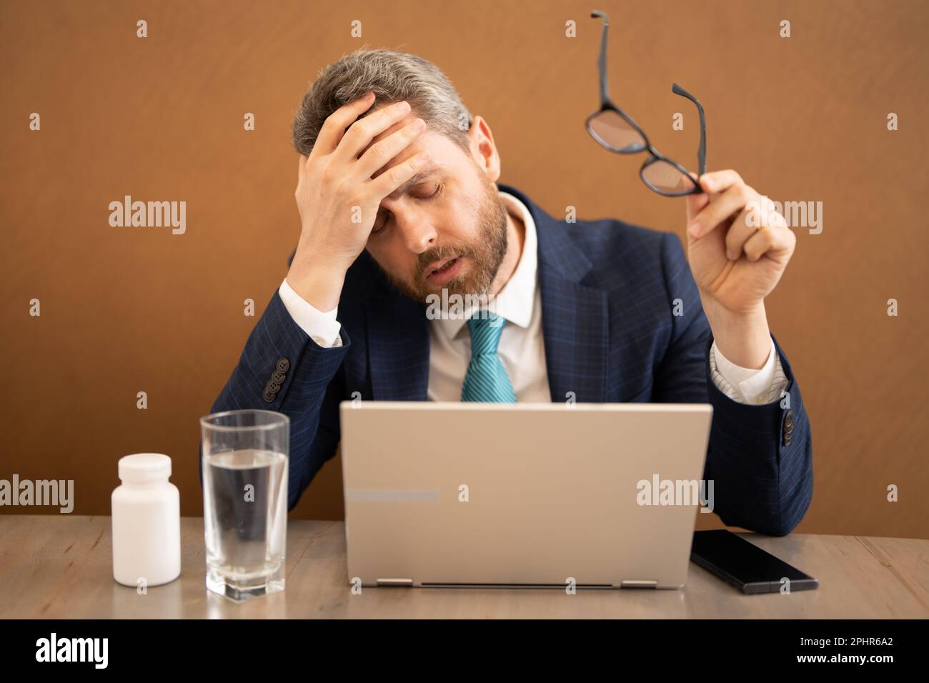 Tired, headache and eye strain on laptop. Man with stress, burnout and ...