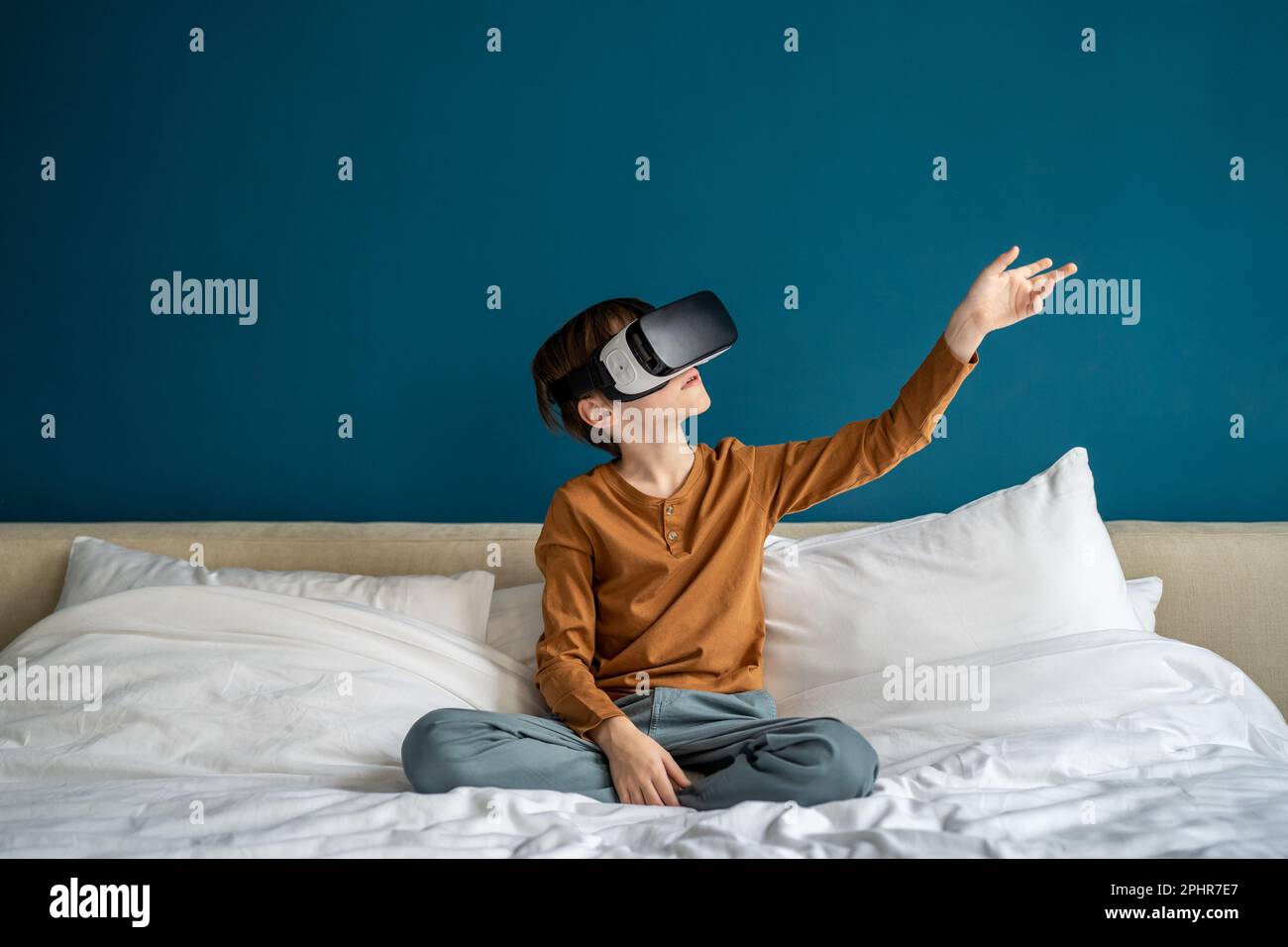 Inspired interested kid boy experience virtual reality goggles ...