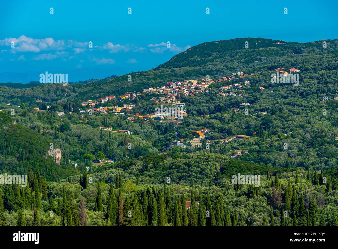 Mountains overlooking Greek resort town Palaiokastritsa at Corfu island ...