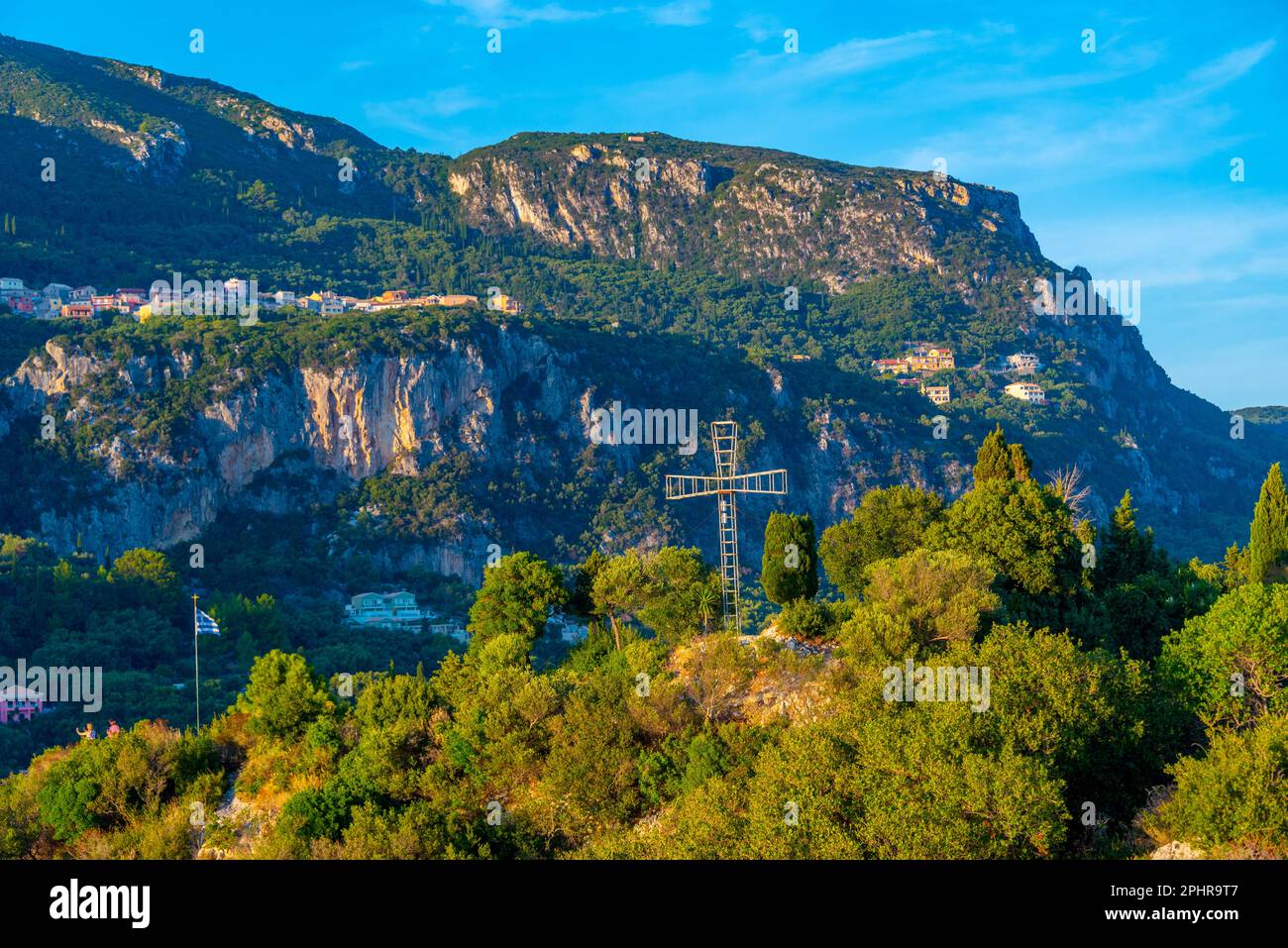 Mountains overlooking Greek resort town Palaiokastritsa at Corfu island ...