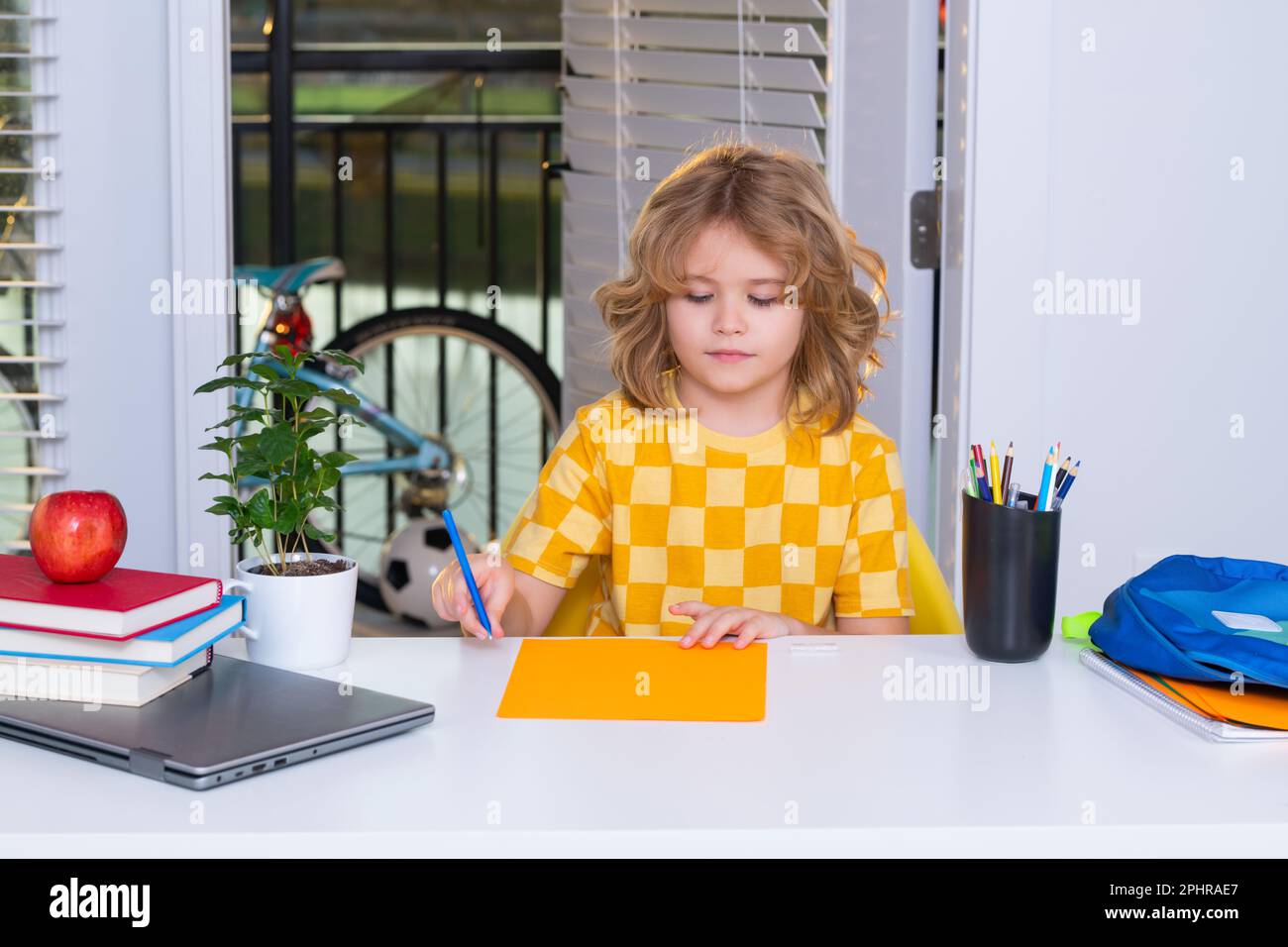 School child writing school homework. Kid boy from elementary school ...