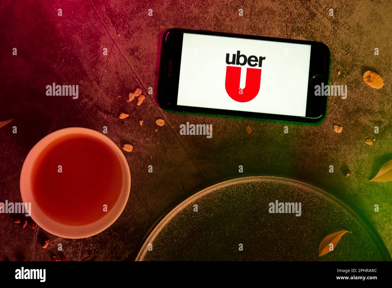 In this photo illustration, the Uber logo is seen displayed on a mobile ...