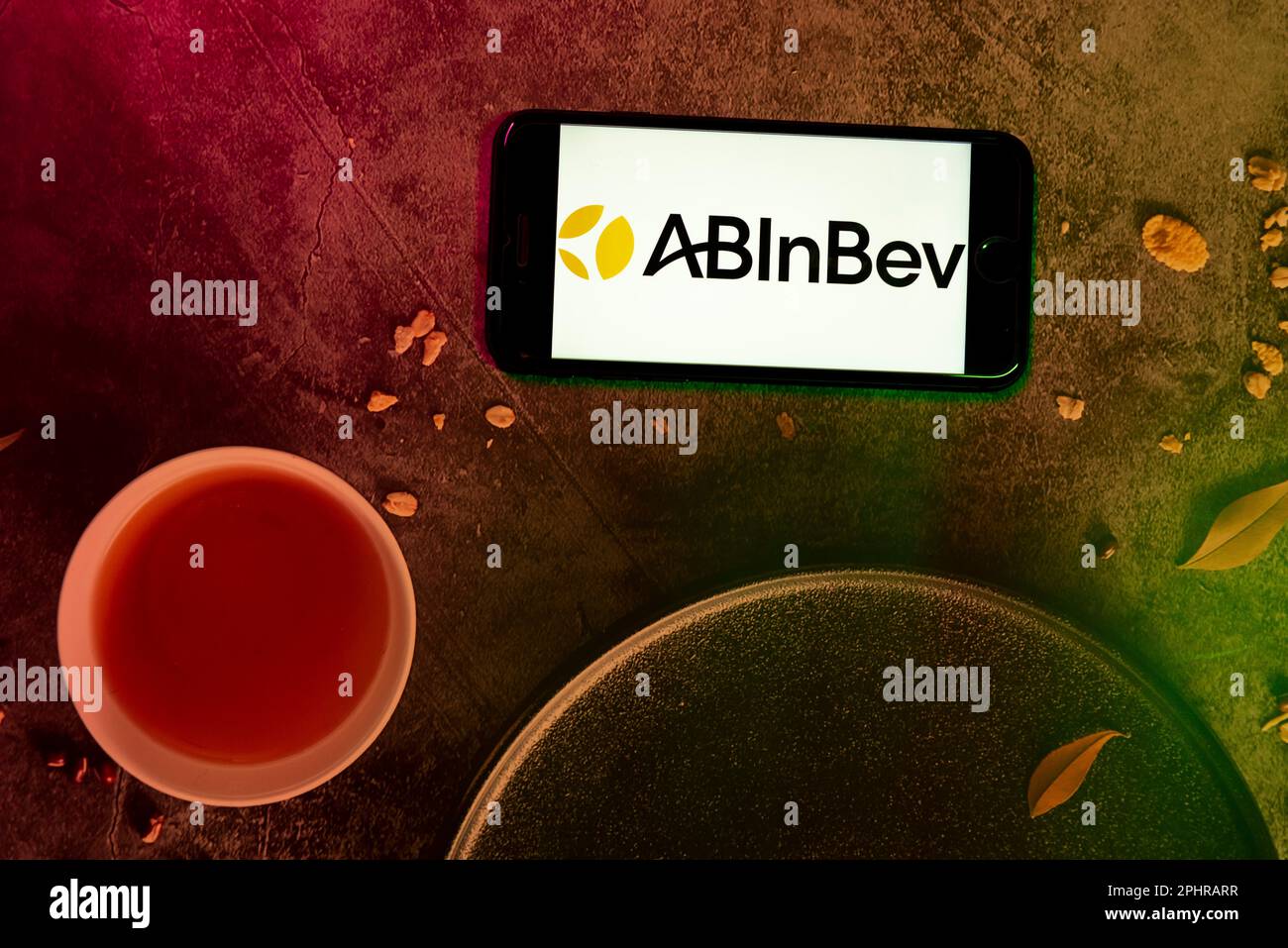 In this photo illustration, the AB inBev logo is seen displayed on a ...