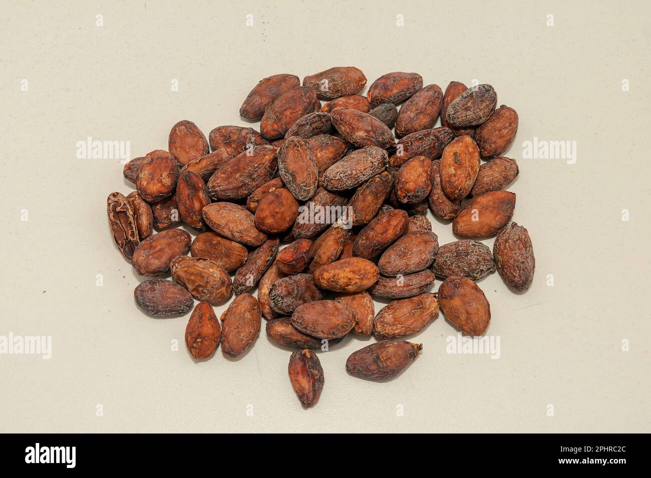 Organic raw cacao beans pile ready for roasting isolated on white ...