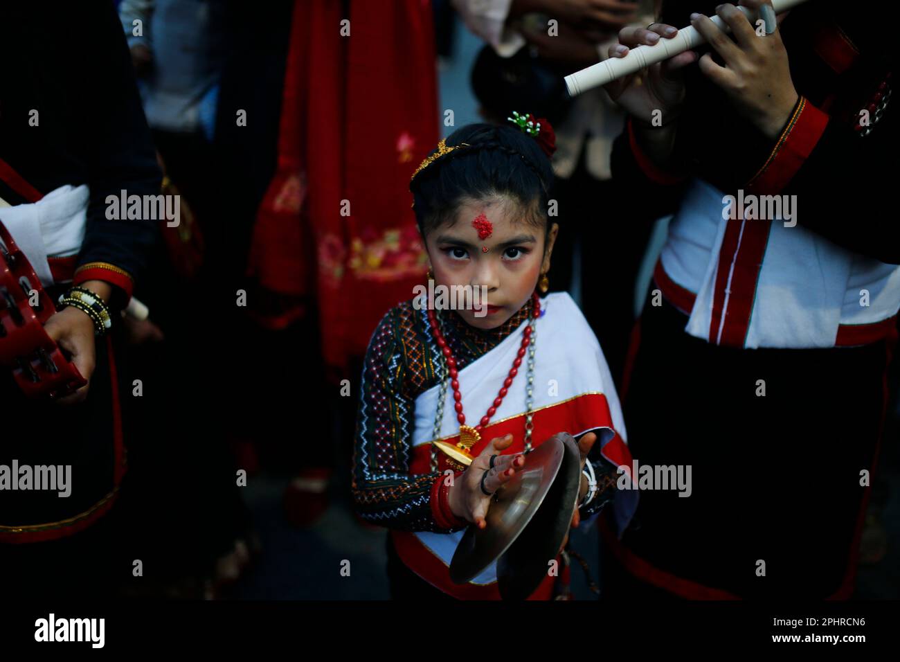 Kathmandu, Nepal. 29th Mar, 2023. A girl donned in traditional attire ...