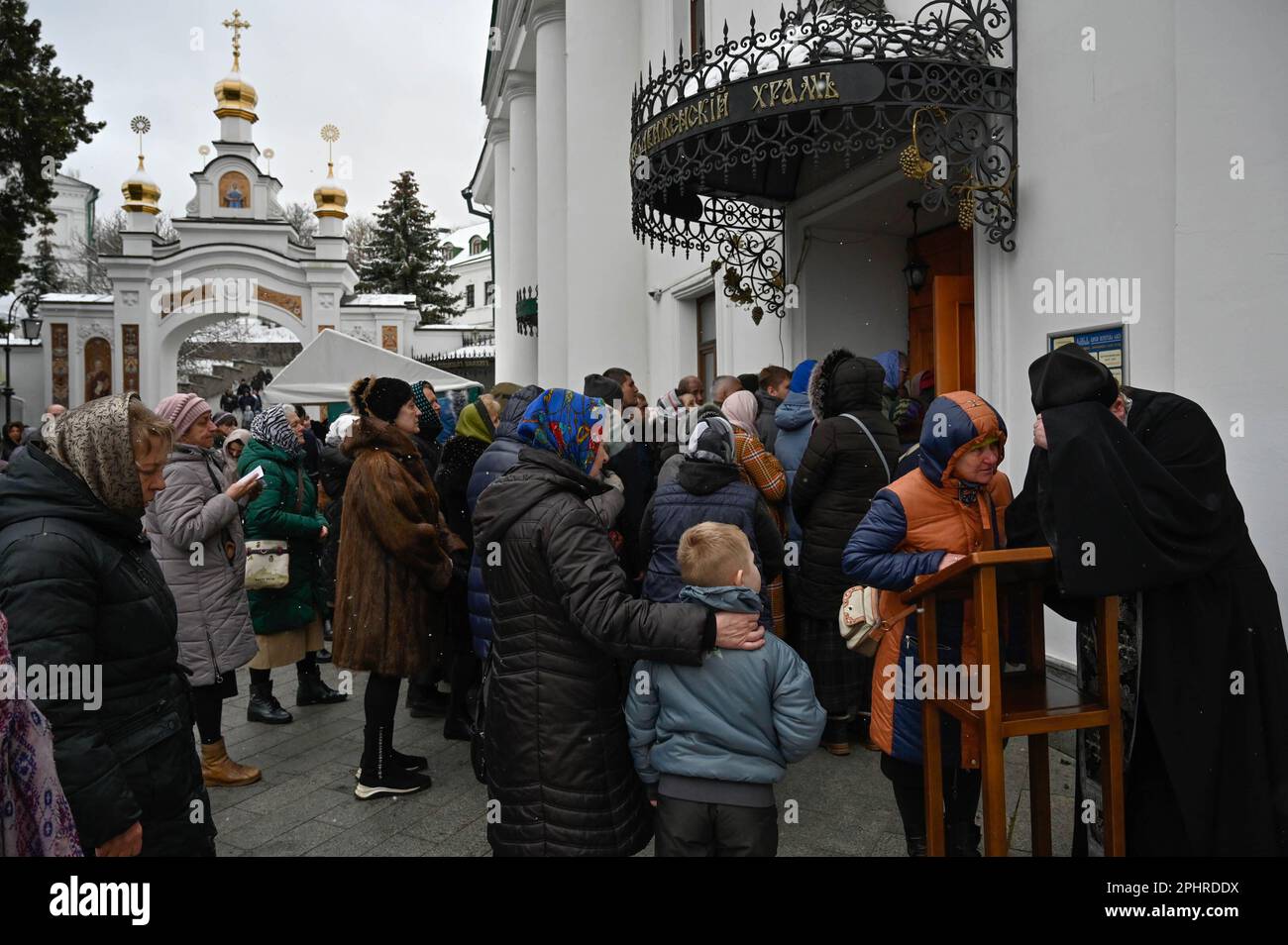 People attend a church service near the Exaltation of the Cross Church ...