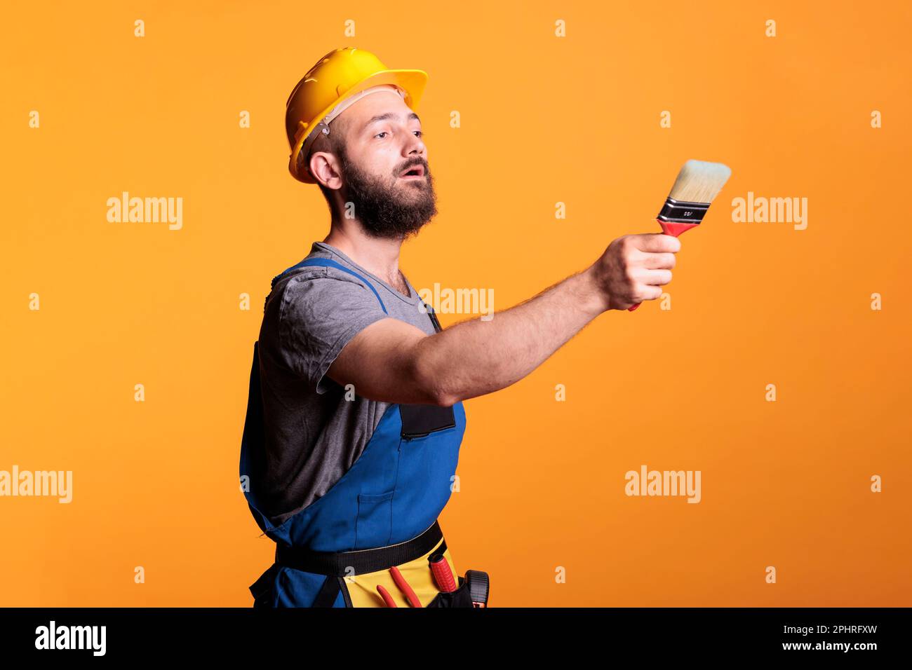 Diy renovator constructor working with paintbrush on new building ...