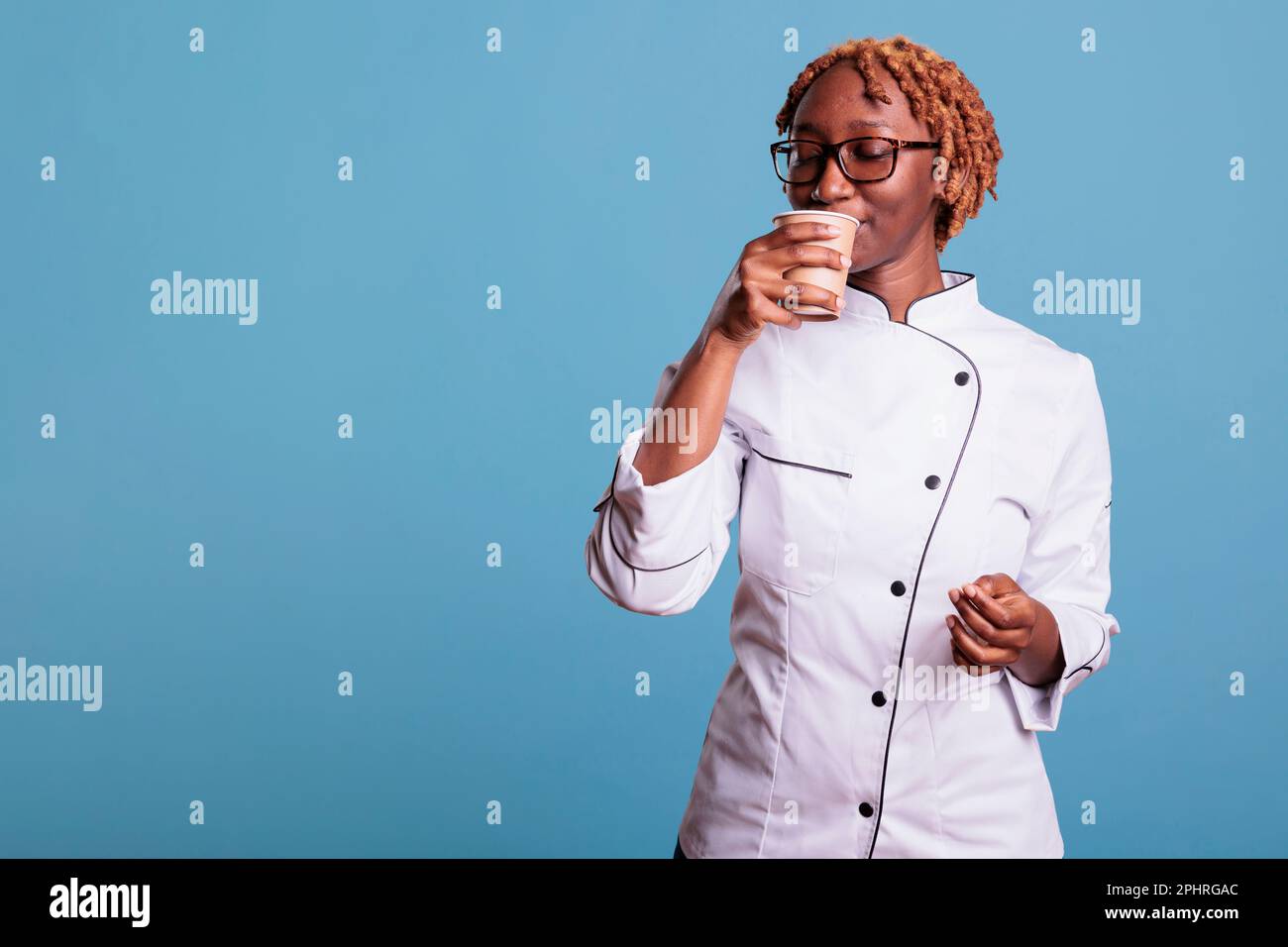 African american female cook enjoying a hot coffee early in the morning ...