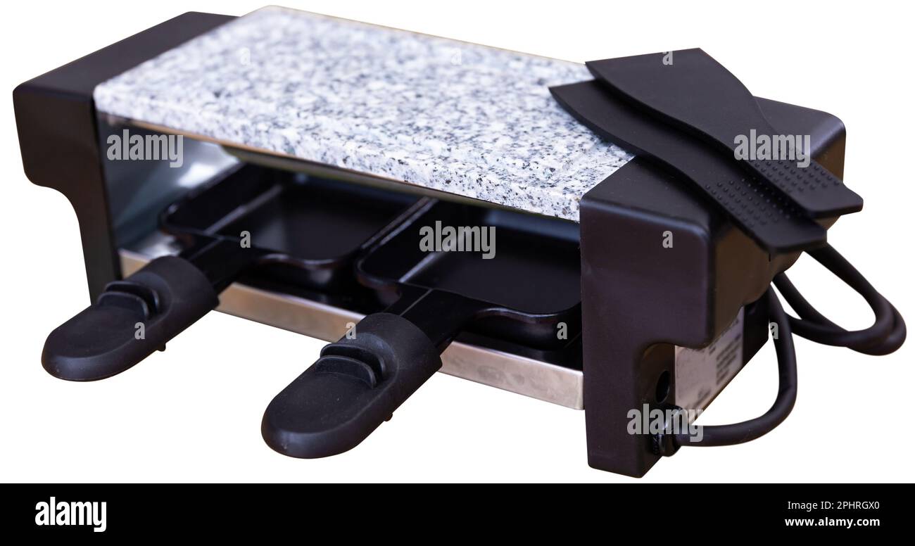 Table-top grill involved in serving swiss dish of raclette Stock Photo ...