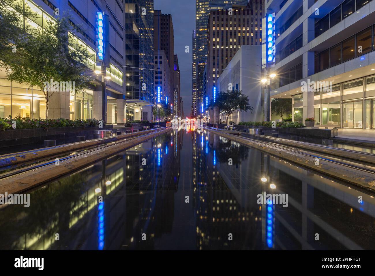 downtown Houston, Texas showcasing lightrails track on water, long ...