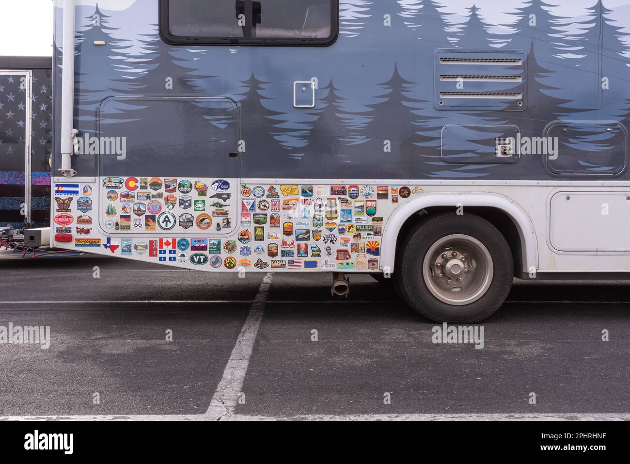 RV with travel stickers decorating the side rear in a parking lot Stock ...