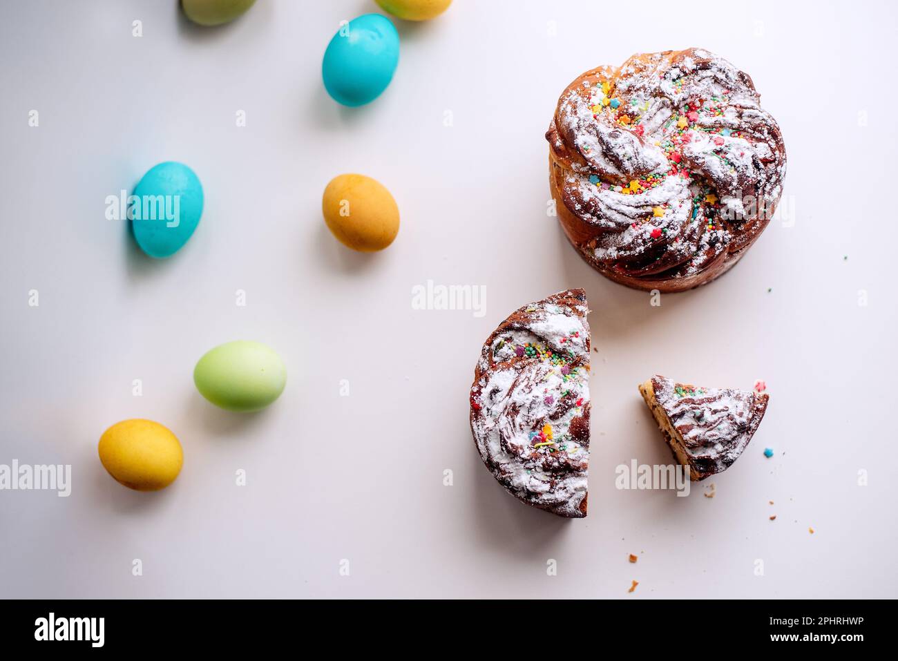 Easter Kraffin on a light background with colored, bright eggs. Cake ...