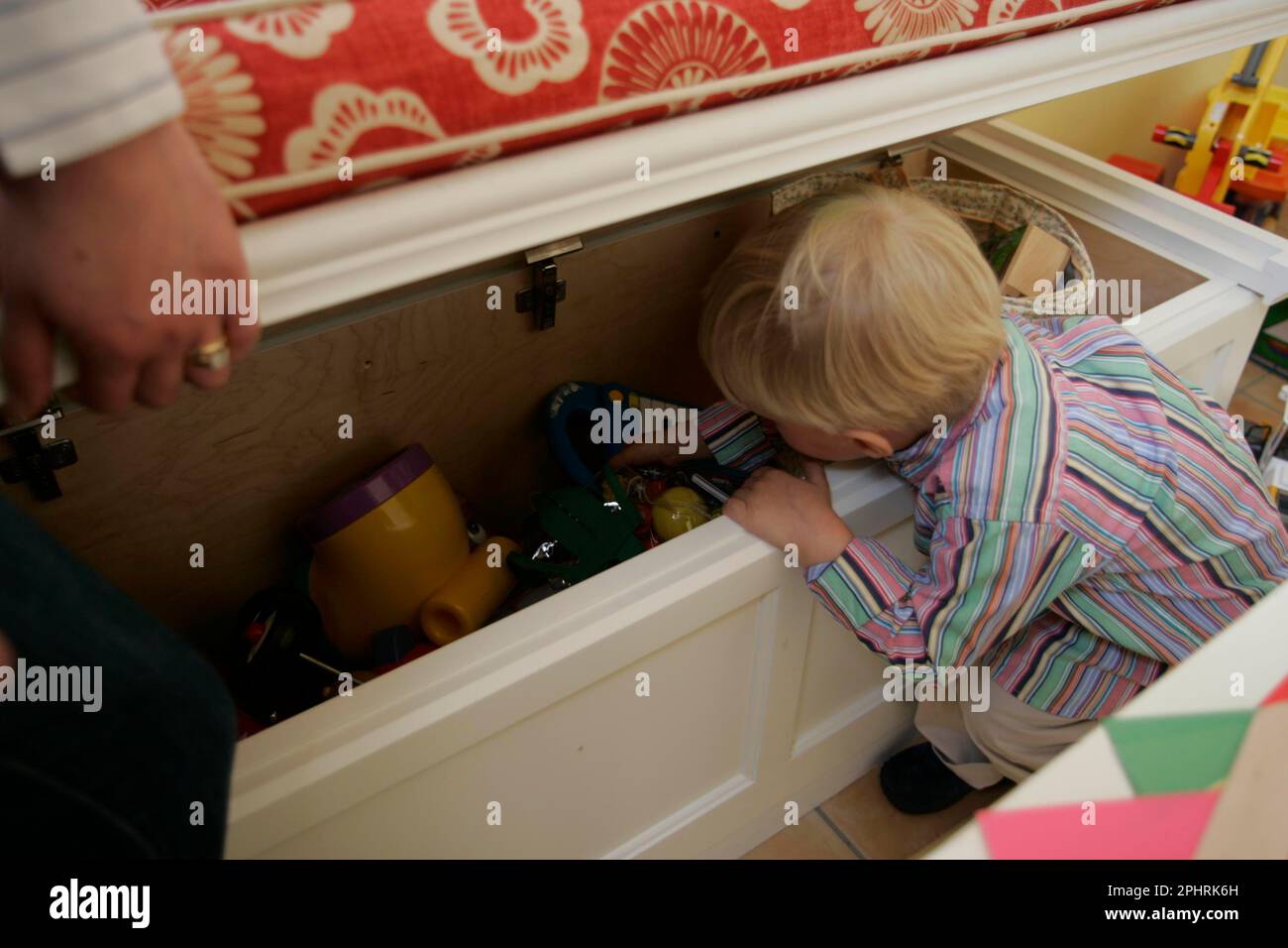 playroom29 064 ls.JPG Child digs through the storage underneath a built ...